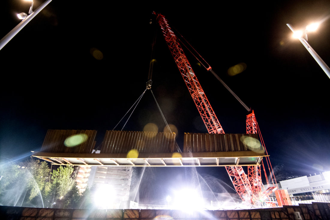 An engineering feat completed as Northeastern pedestrian bridge that ...
